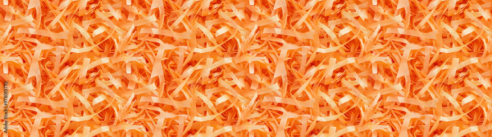 shredded paper filler in orange color with thin, delicate strips ...