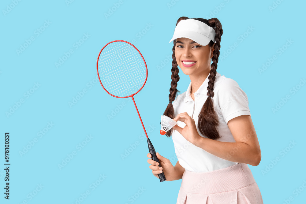 Beautiful young happy badminton player with braids holding racket and ...