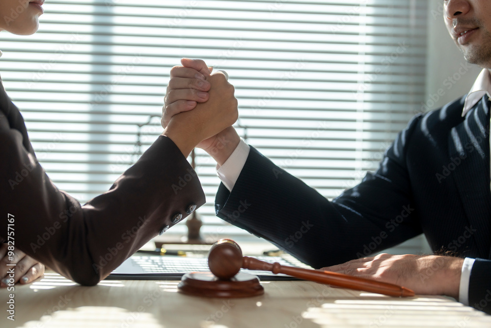 Lawyers arm wrestling during legal dispute resolution Stock Photo ...