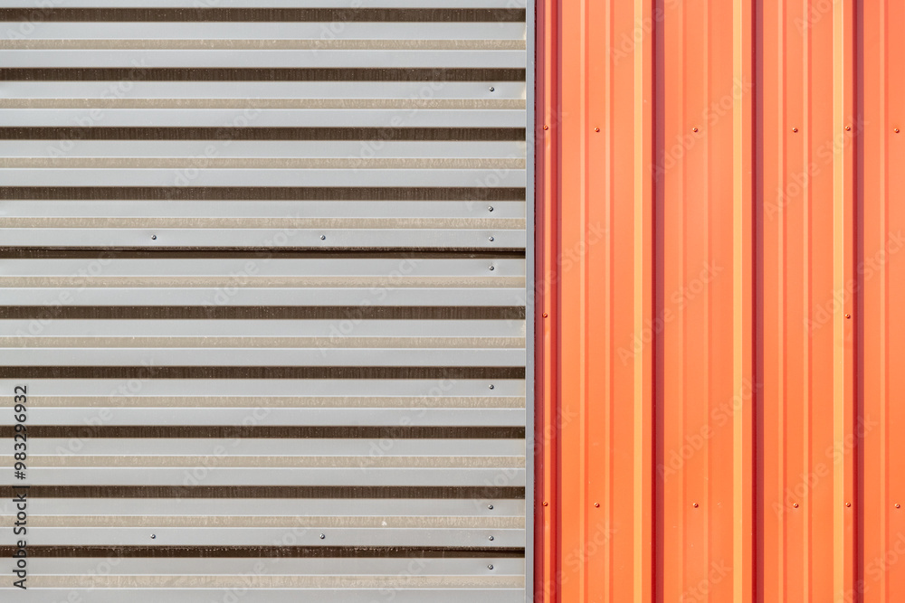 Grey and orange metal composite panels both horizontal and vertical ...