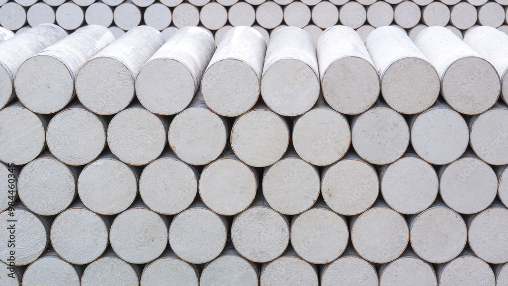 Concrete cylinder micropile background. Stack of many precast spun ...