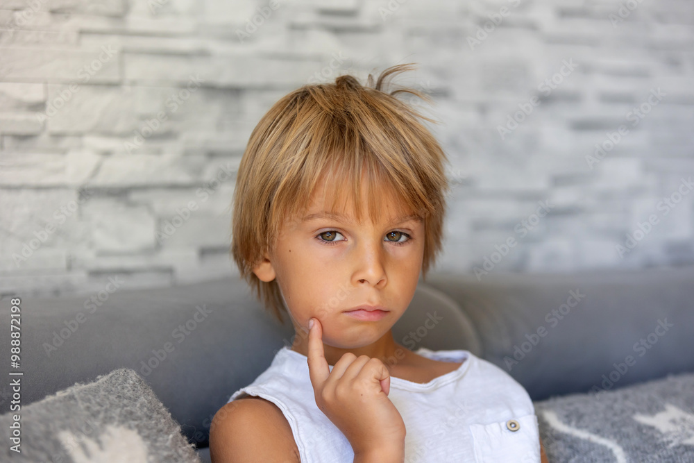 Blond child, cute preschool boy with swollen face from a toothache ...