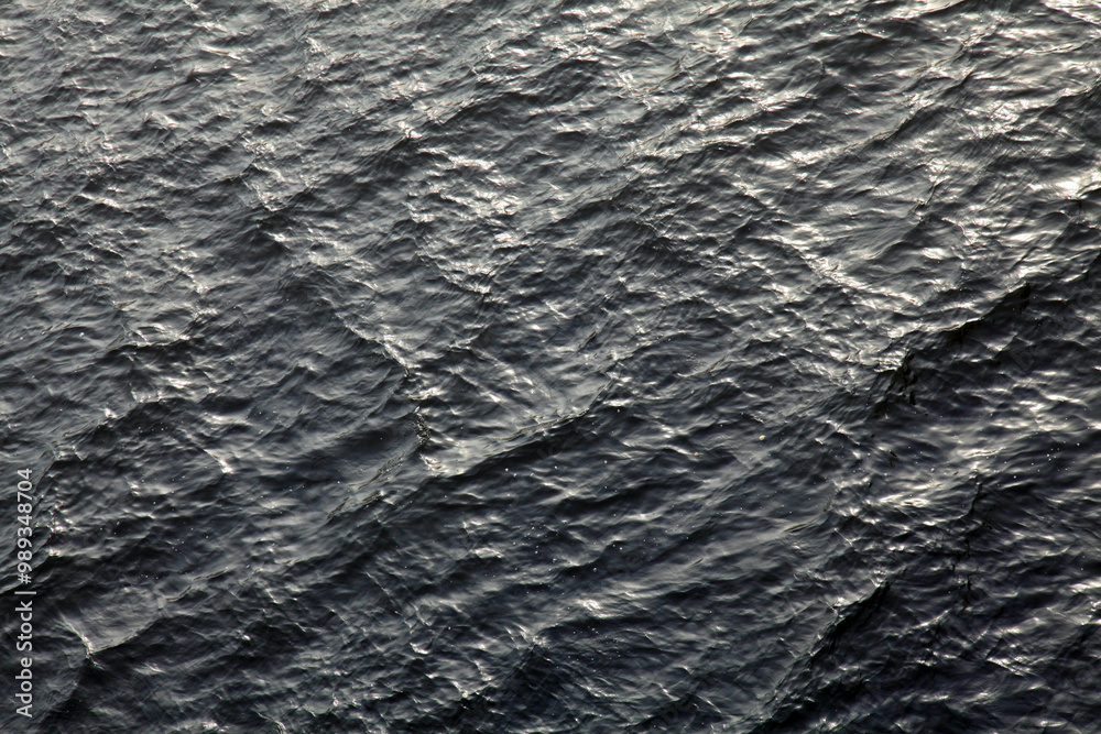 Gray wavy surface, texture, background. Dark water surface in late ...
