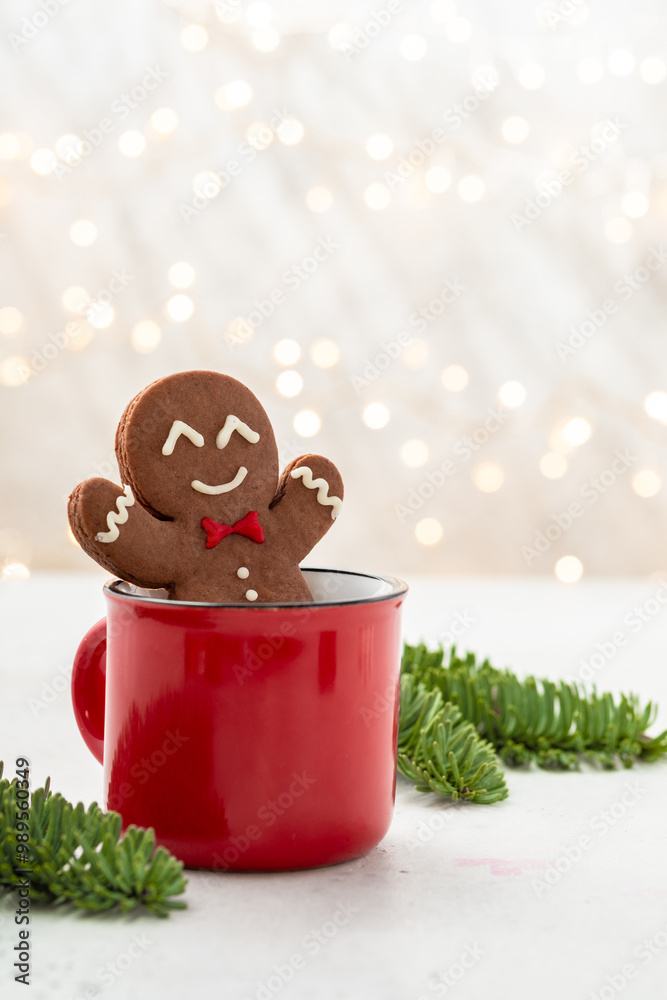 A gingerbread man is sitting in a cup of hot chocolate Stock Photo ...