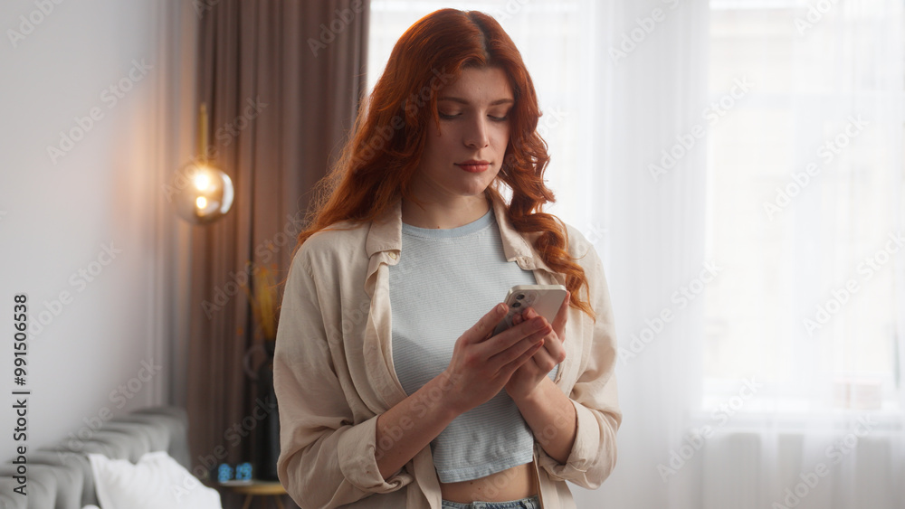 Caucasian woman lady using mobile cellular phone reading messages news ...