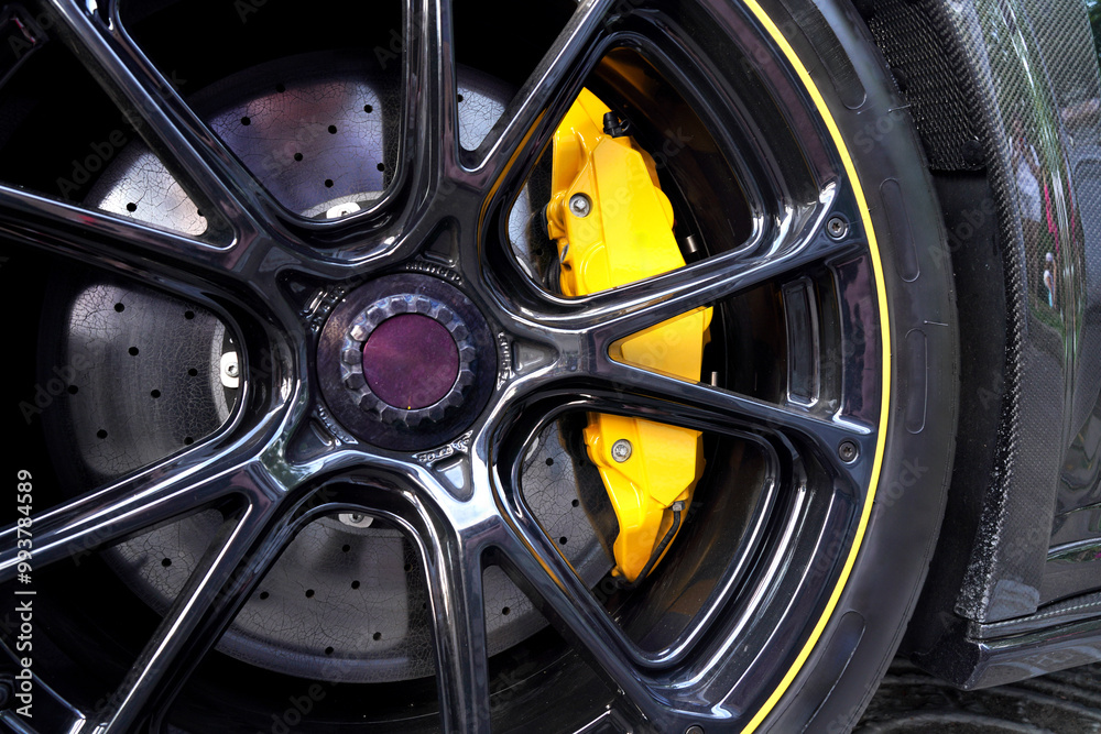 Alloy wheel with calipers and racing brakes of the sport car. Racing ...