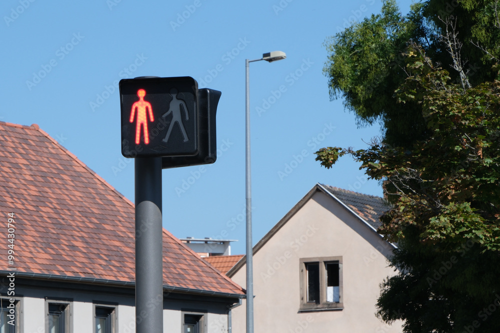 Pedestrian semaphore traffic light with red stop signal in shape of man ...
