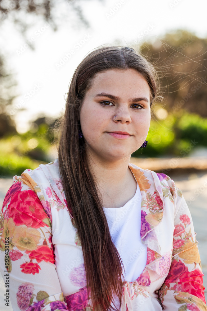 First Nations Australian Torres Strait Islander teen girl sitting on ...
