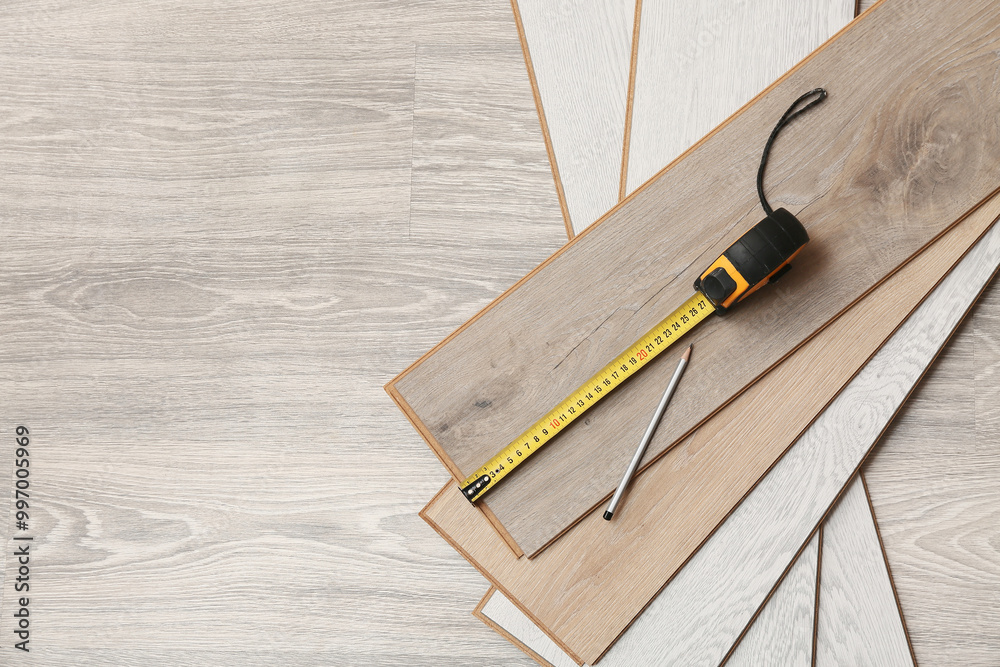 Measuring tape and laminate boards on floor Stock Photo | Adobe Stock