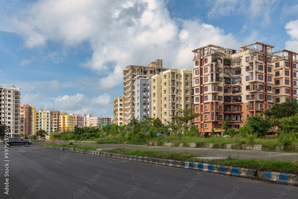 Residential multistory apartment buildings with view of city road at ...