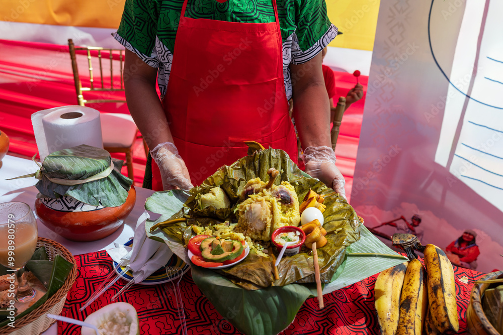 Chicken juane wrapped in bijao leaves. Food, fruits and drinks of the ...