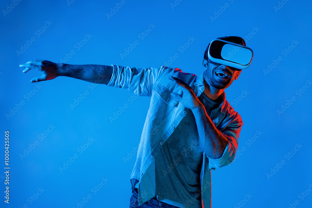 Handsome smart man dancing and moving gesture to music by using VR ...