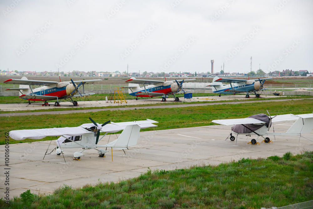 Ultralight small sports aircraft and agricultural aircraft parked at ...