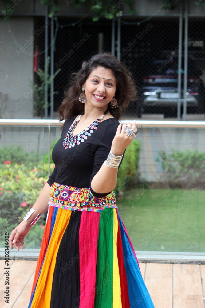 woman in stylish and modern navratri look with heavy neckless and multi ...