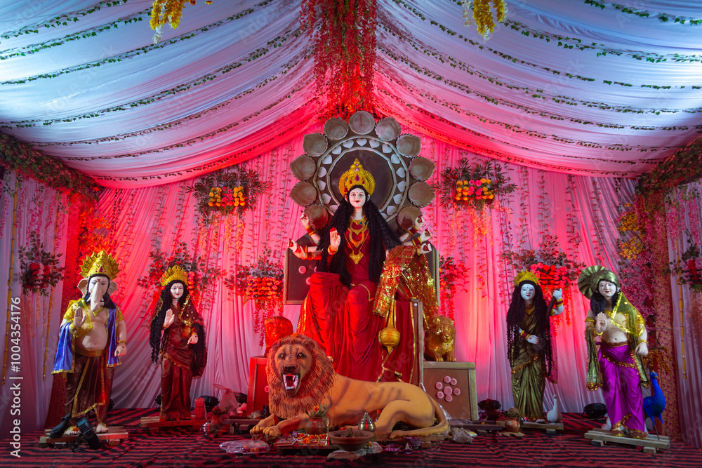 A beautiful idol of Maa Durga being worshipped at a pandal during ...