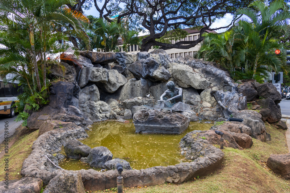 The Ka Mea Ku'i 'Upena sculpture a Seated figure of a male with a net ...