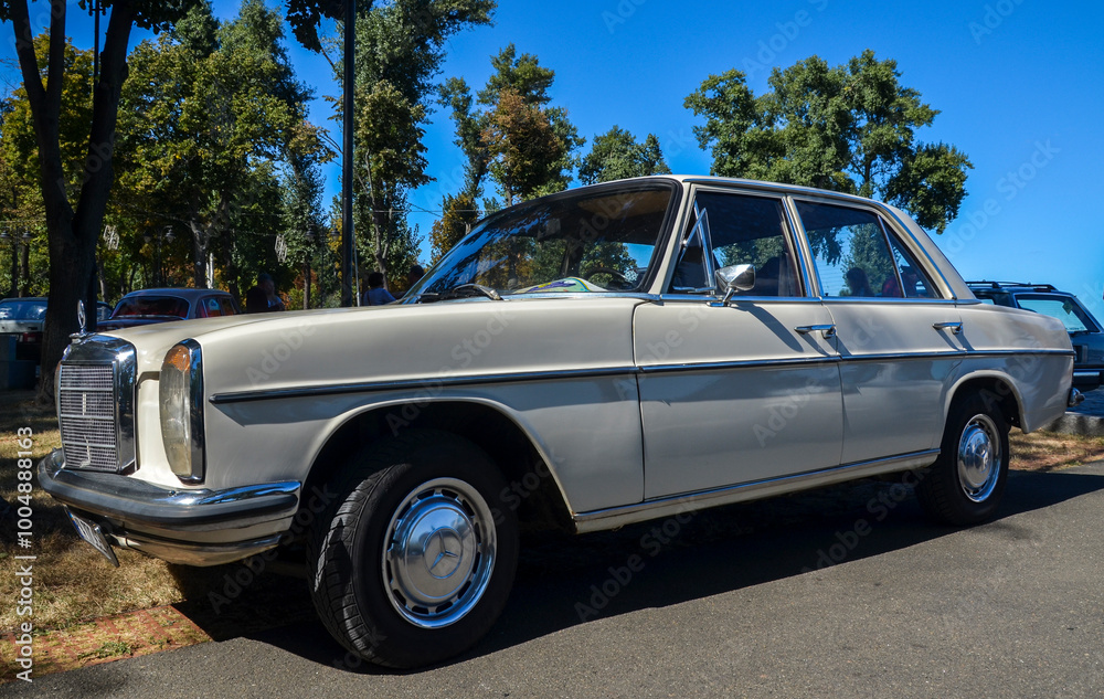 Classic white sedan Mercedes Benz W115 known for its robust build and ...