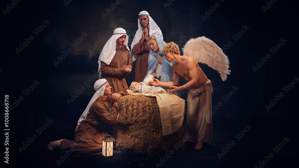 Nativity scene with Mary, Joseph, shepherds and angel around baby Jesus ...
