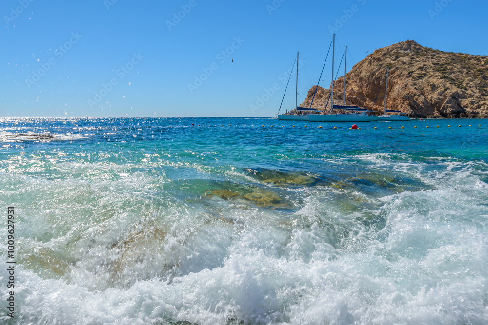 Different stages of the fantastic ocean waves. Rocky and sandy beach ...
