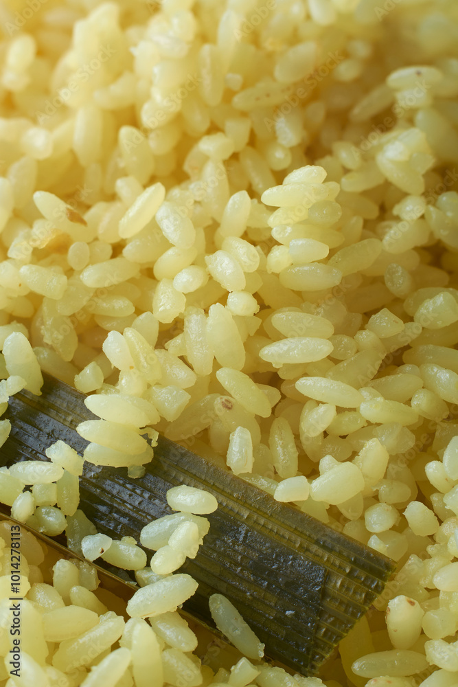 yellow colored rice cooked with clarified butter close-up macro view ...