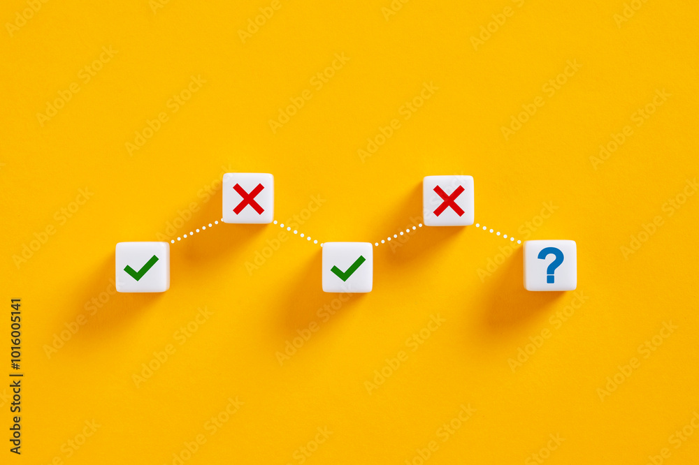 Question mark and check and cross marks forming chart on yellow ...