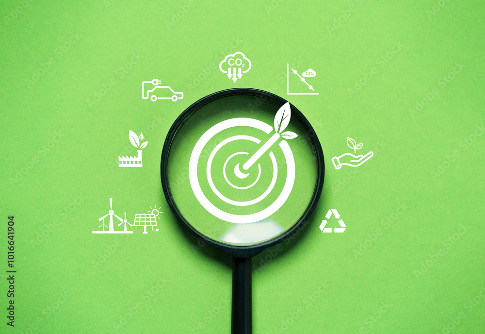 Target board with arrow inside of magnifier glass among environment ...