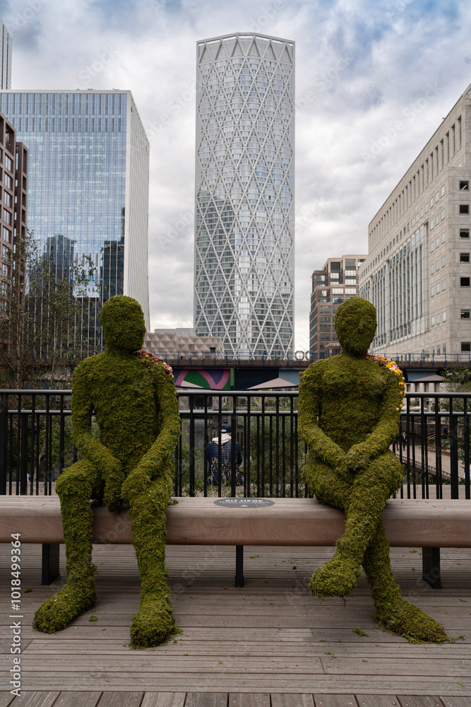 Two grass statues sat next to each other in the Eden Wharf project in ...