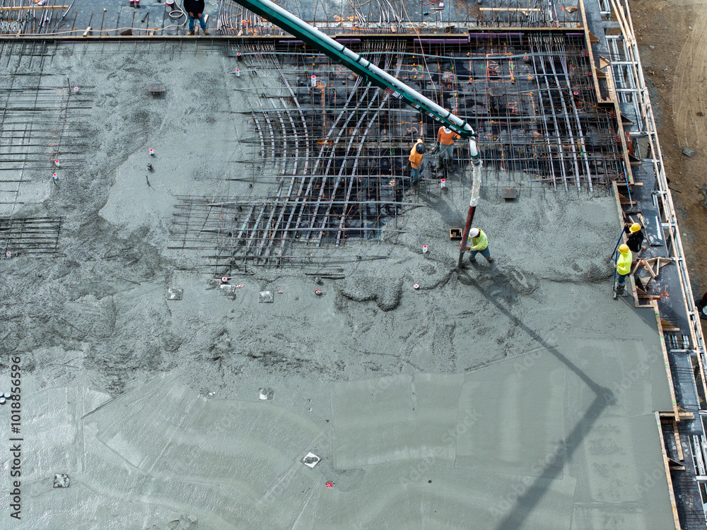 Pouring a concrete slab with an industrial pump Stock Photo | Adobe Stock