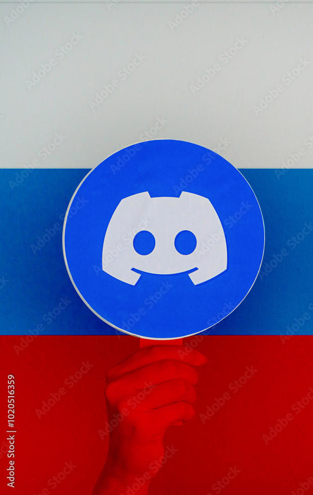 Girl holding icon with Discord logo and laughing emoji. Discord is the ...
