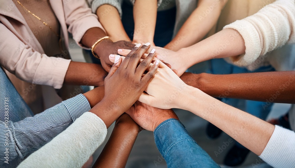 A group of people with their hands in the middle and stacked on top of ...