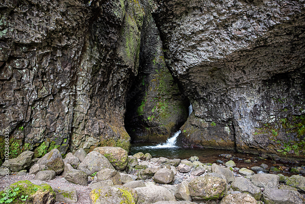 Landscape photography of waterfall in Smugglers Cave, Alva glen, Scotland, stones; rocky ...