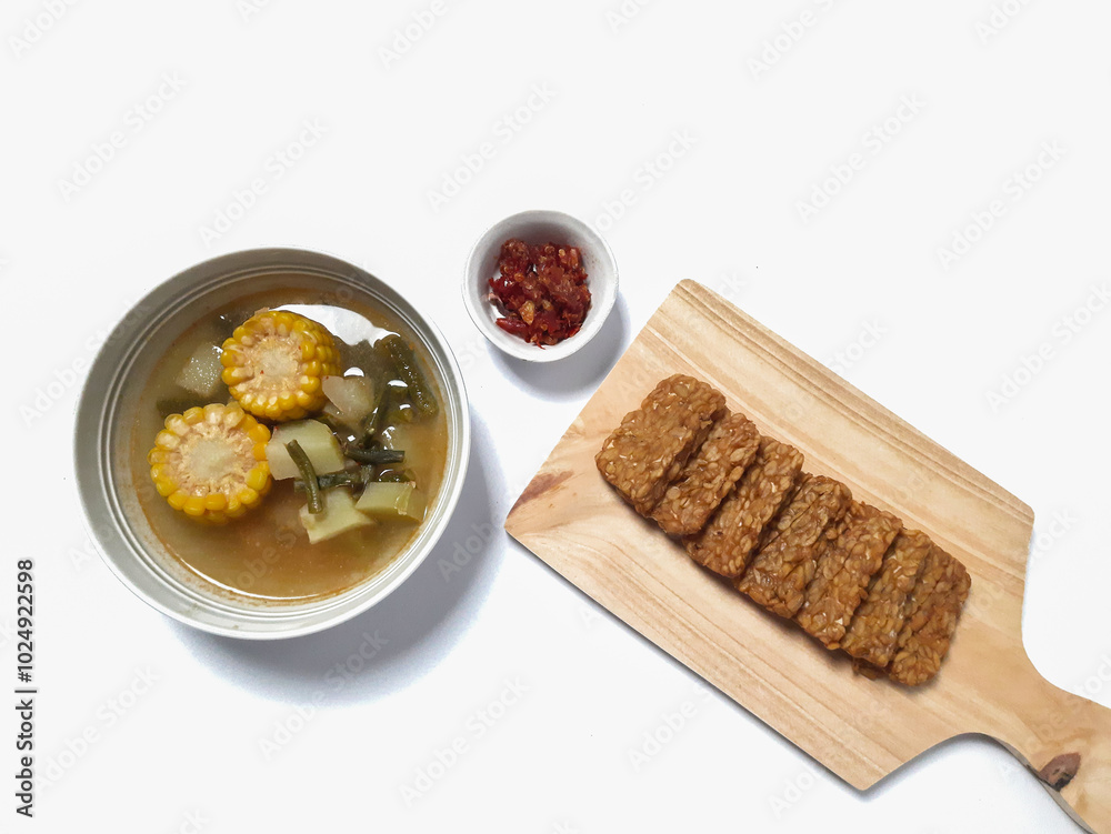 Sayur asam or sayur asem is popular soup in Indonesia. Served in a bowl ...