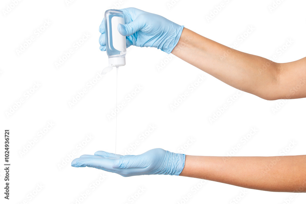 Two hands in medical gloves, one pouring antiseptic on the other, on an ...