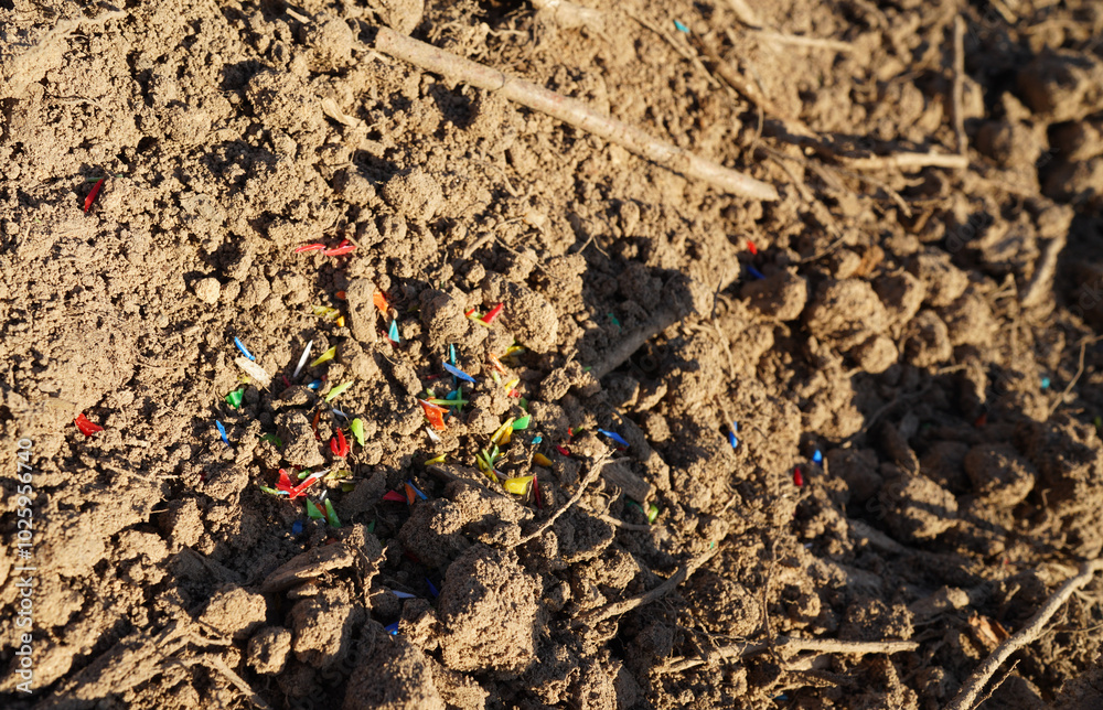 Microplastic pollution. Microplastics in ground. Soil contaminated with ...