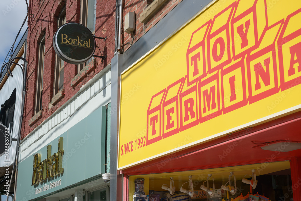 exterior building facade and signs of Toy Terminal and Barkat, an ...
