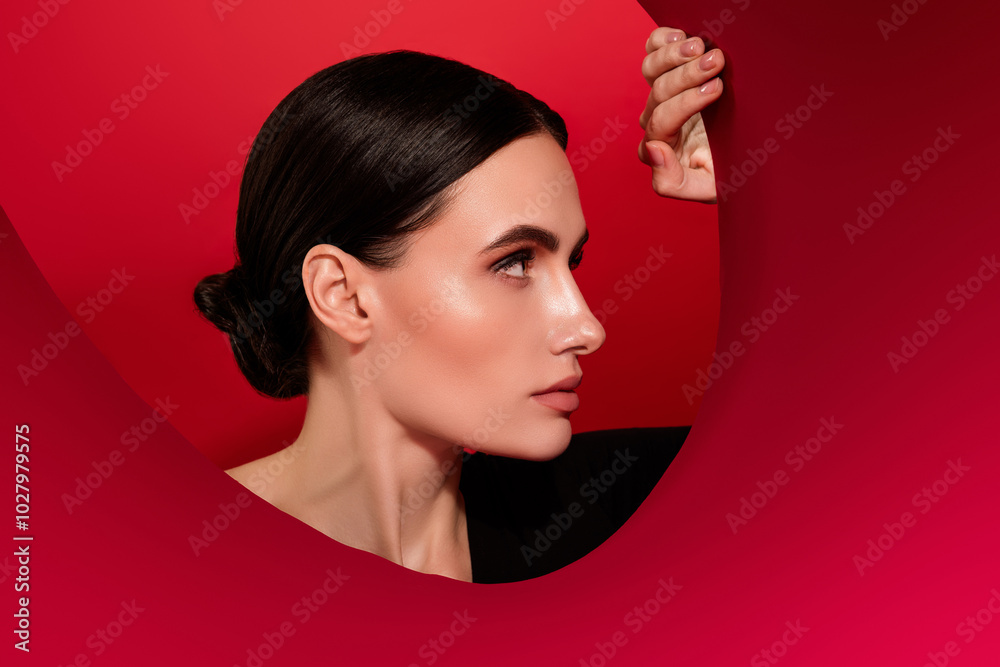 Photo of stunning girl from hole in red backdrop background look ...