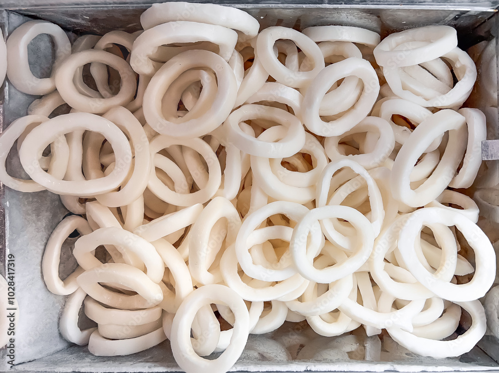 Squid rings. Frozen squid seafood in fish market. Frozen squid ...