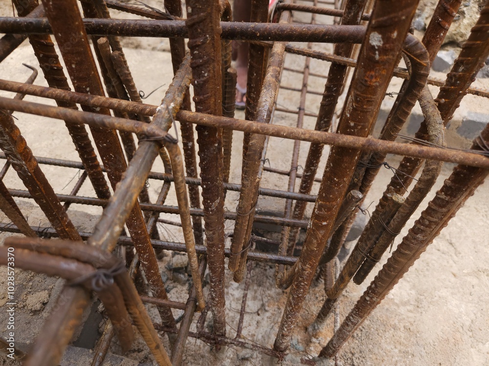 Photography, construction workers using reinforced tmt steel bar with ...