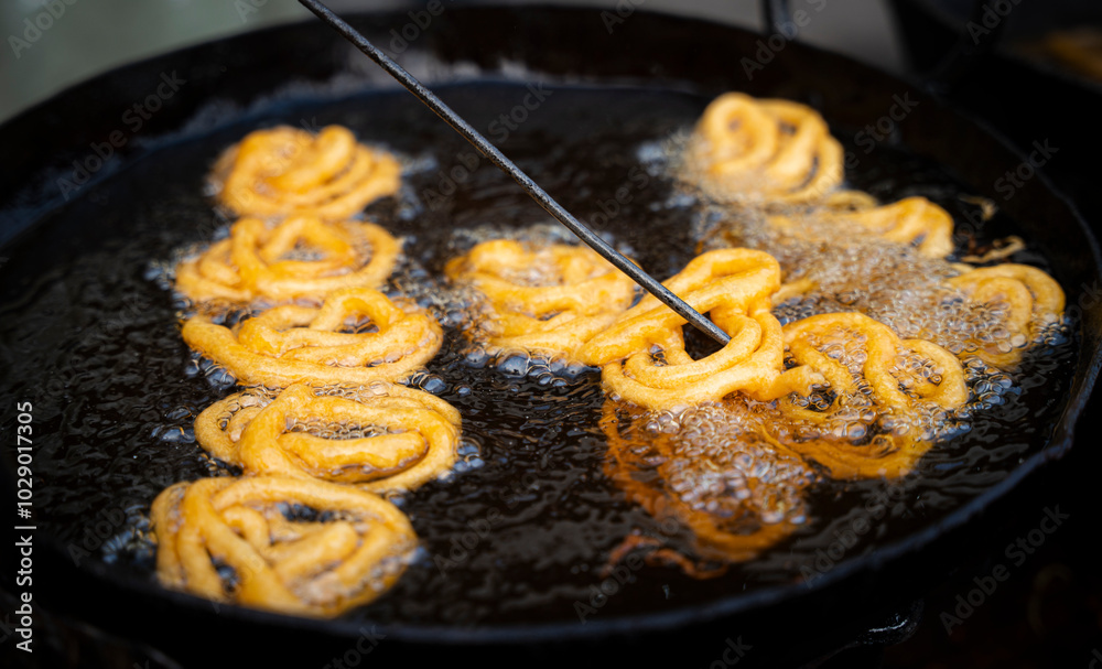 deep fried jalebi to sell at a stall Stock Photo | Adobe Stock