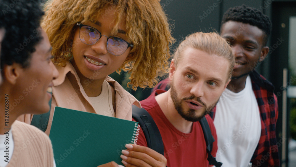 Closeup speaking smiling laughing five gen z diverse multiracial students boys girls talk walk ...