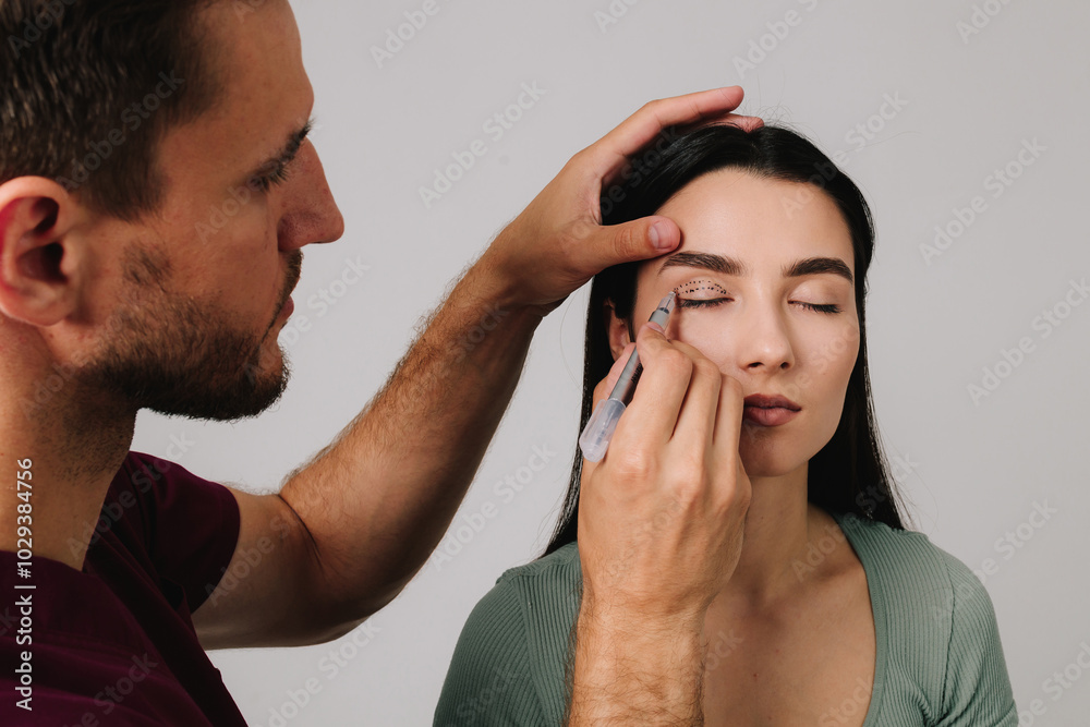 Blepharoplasty. Plastic surgeon is marking up contour for upper ...