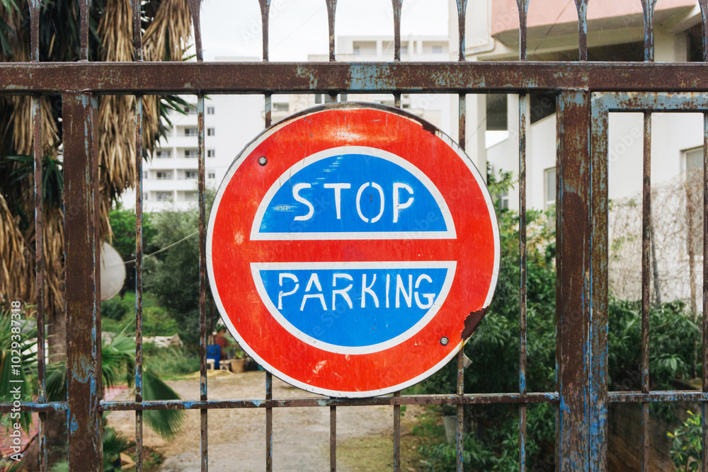 Stop parking sign on a rusty metal gate. Private property entrance. Old ...