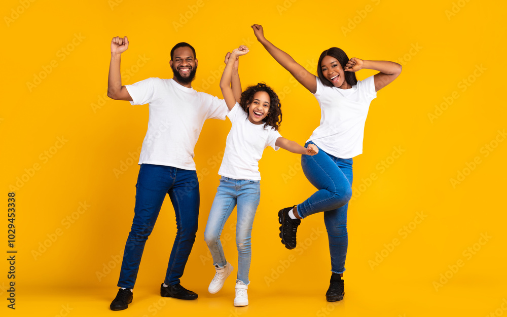 Having Fun. Full body length of excited young black family of three ...