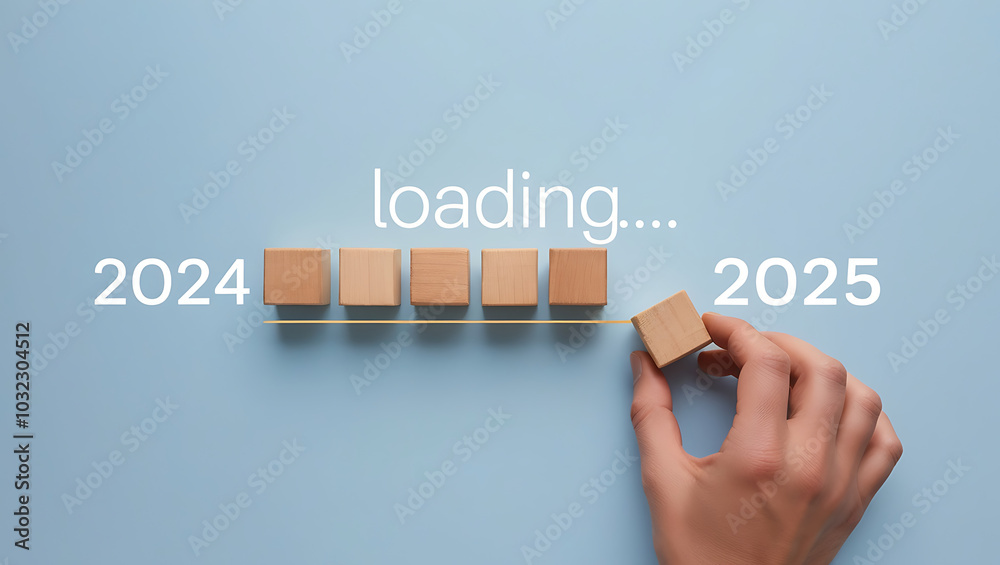2025 loading, 2024 to 2025 loading wooden bar. A hand places wooden ...