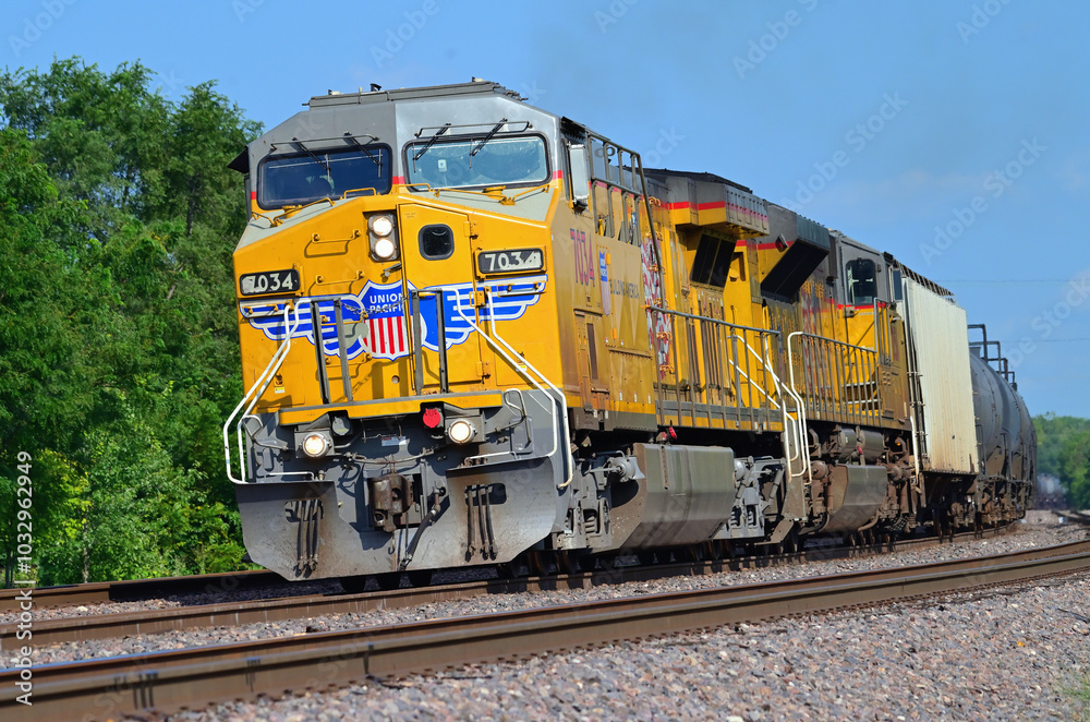 With its long ethanol train strung out behind, multiple locomotives ...
