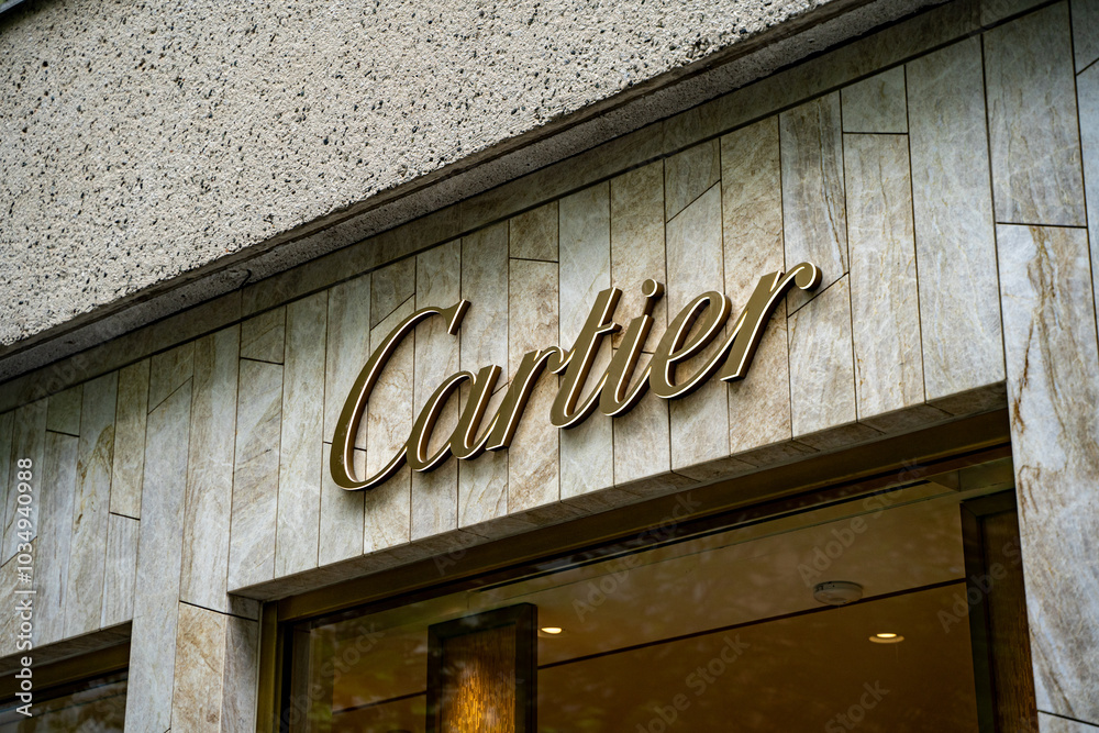 Cartier logo store sign. Cartier is a French luxury-goods conglomerate ...