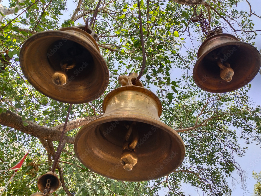 Beautiful bells made of brass hung in an ancient Hindu temple in India ...