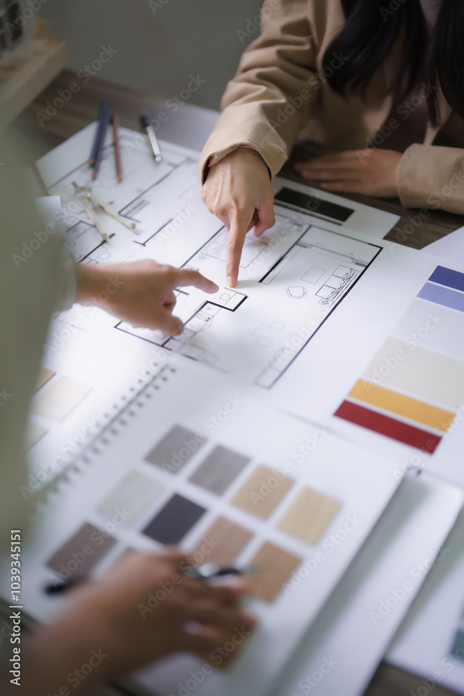 Two female architect discussion and inspection interior designing and ...