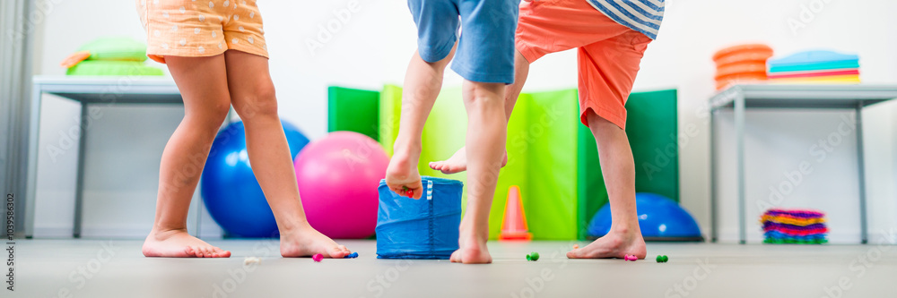 Young children exercising during group therapy session. Child ...