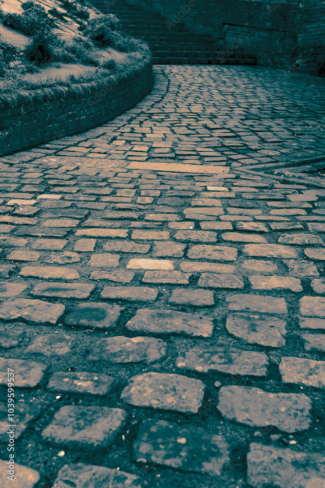 block paving path pavement sidewalk with steps and wall in an old ...